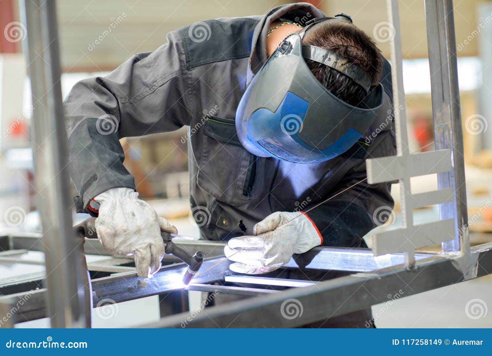 Man leaning over welding stock image. Image of mask - 117258149