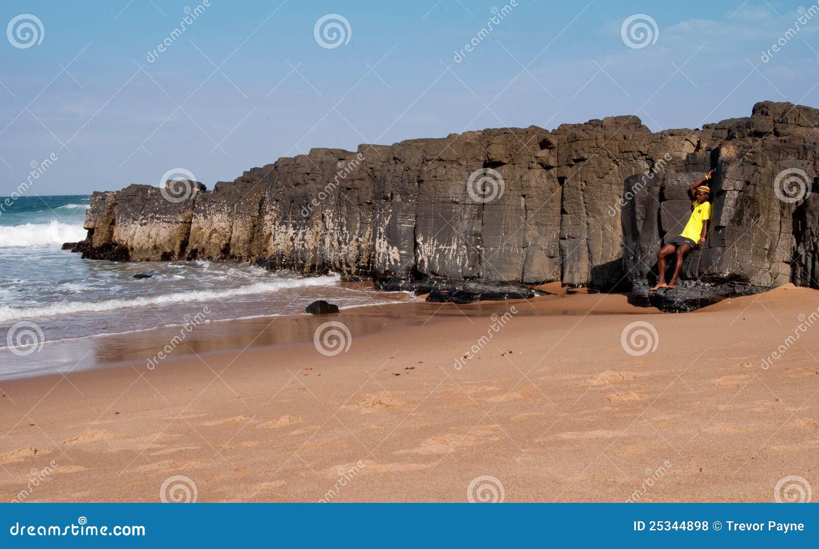 Man Leaning on Rocks at the Seaside Stock Photo - Image of resting ...