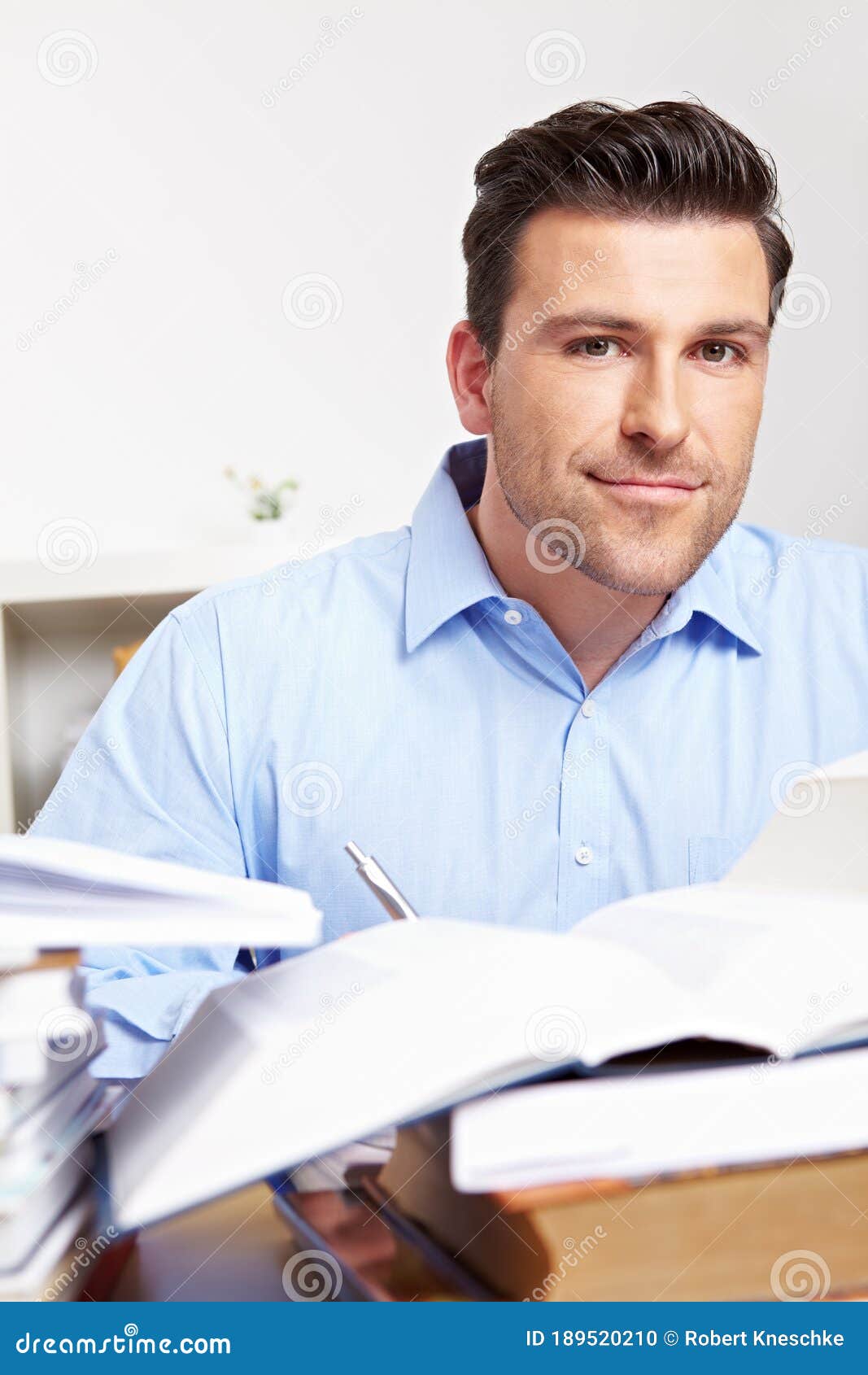 Man is Learning between Piles of Books Stock Photo - Image of read ...