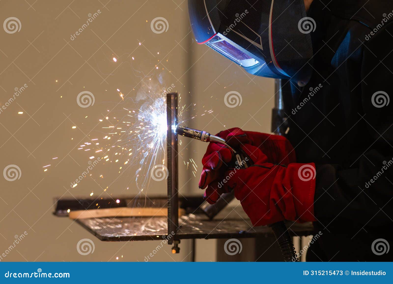 A Man Learns the Craft of Welding on a Sample. Stock Image - Image of ...