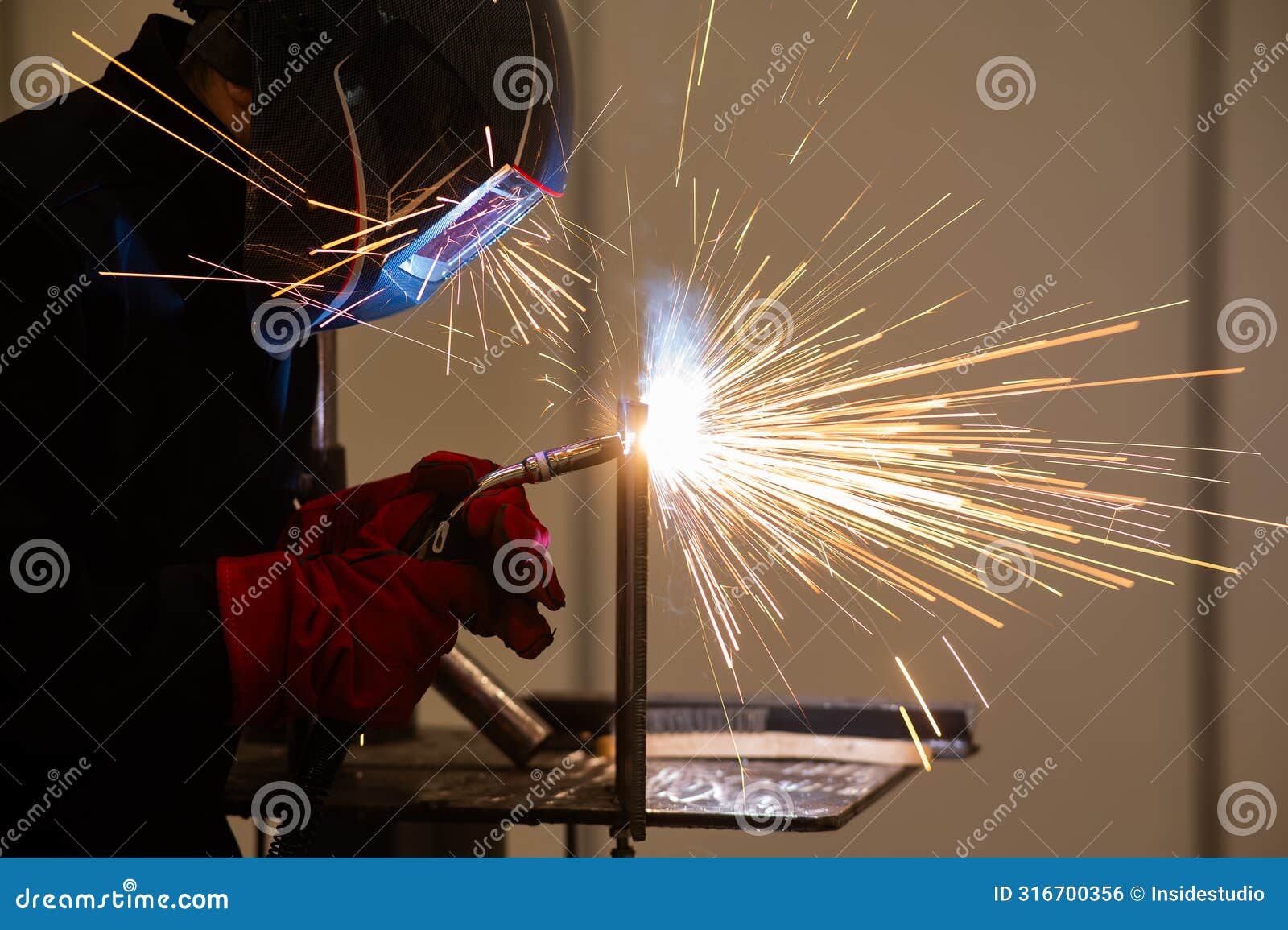 A Man Learns the Craft of Welding on a Sample. Stock Photo - Image of ...