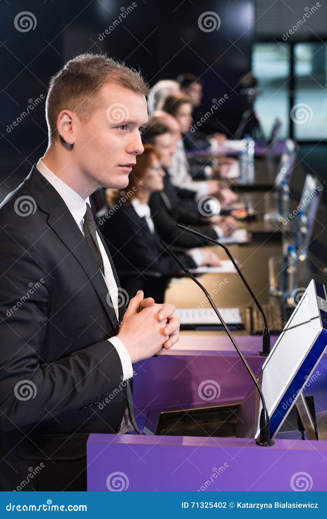 Man at lectern stock photo. Image of congressman, suit - 71325402