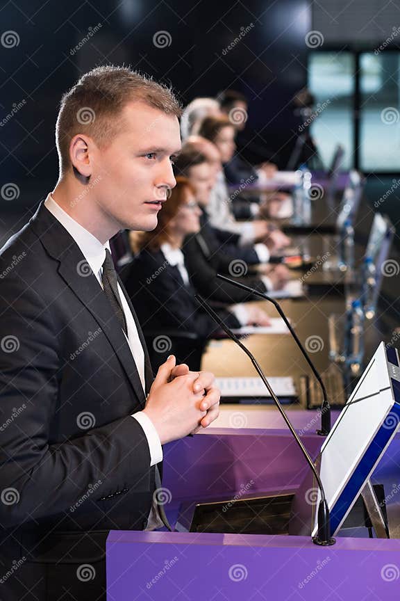 Man at lectern stock photo. Image of congressman, suit - 71325402