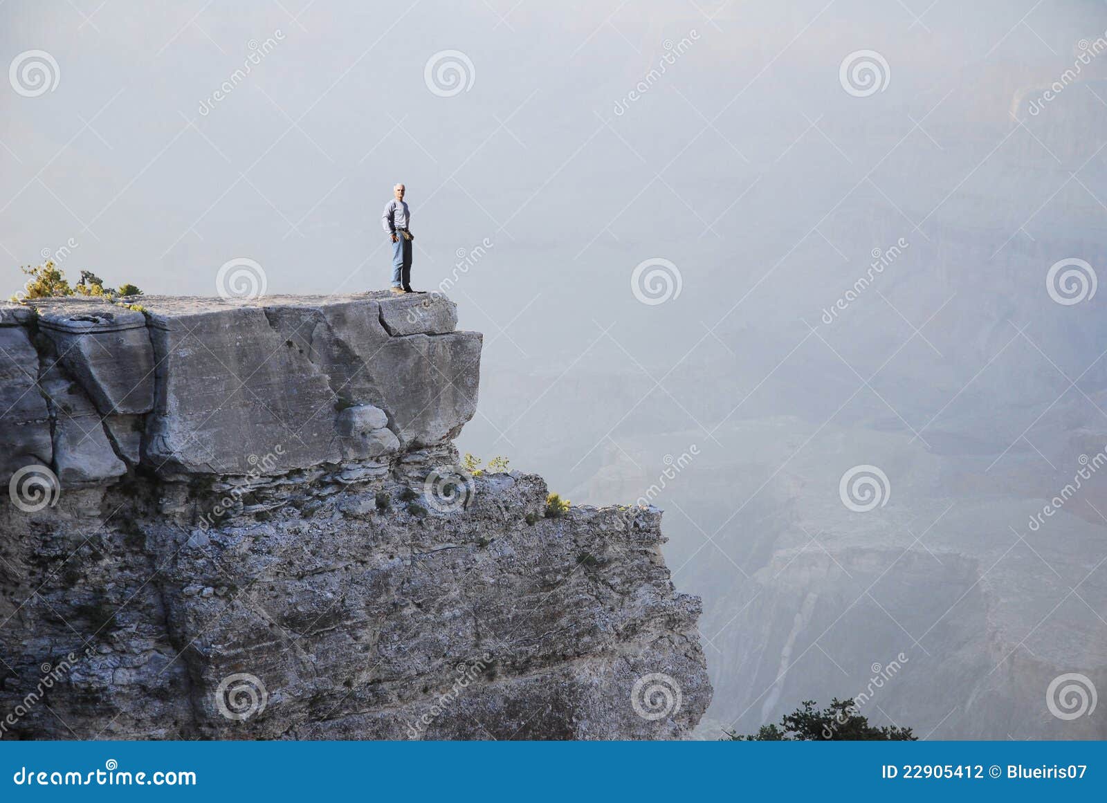 Man on a ledge stock photo. Image of park, foggy, climb - 22905412