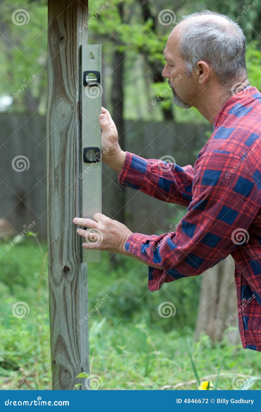Man leveling post stock photo. Image of carpenter, labor - 4846672