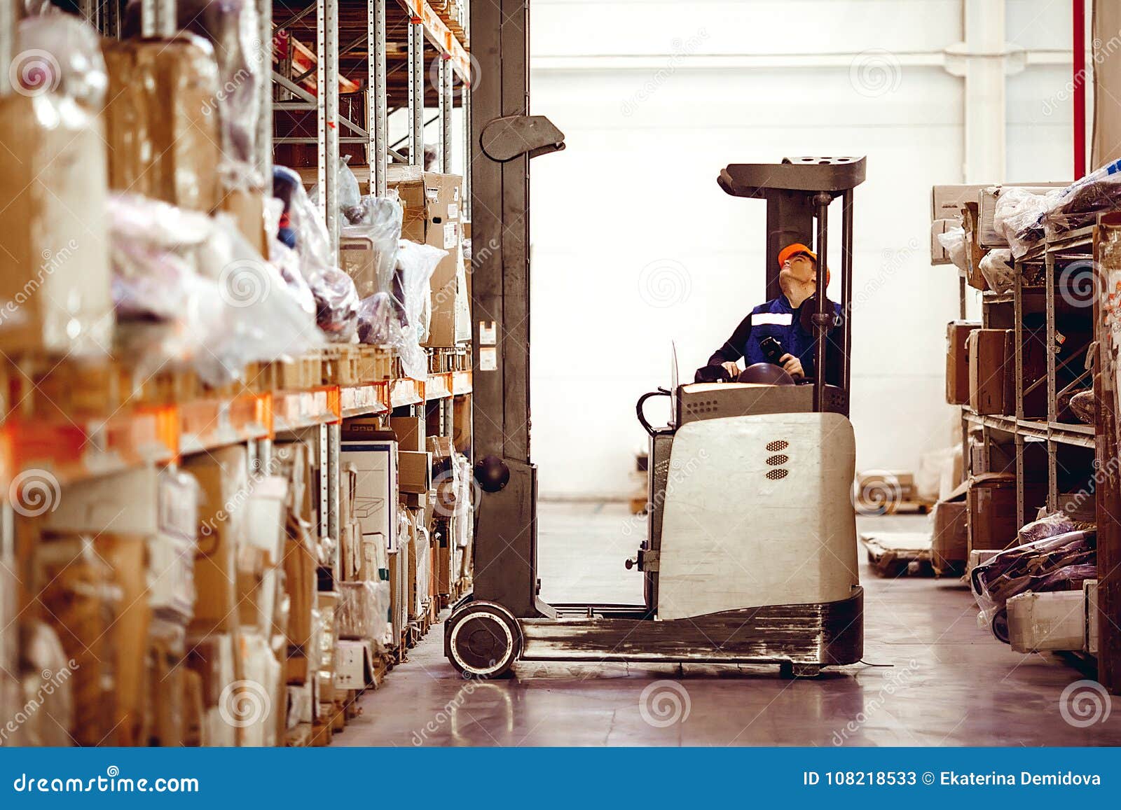 Man on Lift Operator in Uniform at Warehouse Stock Image - Image of ...