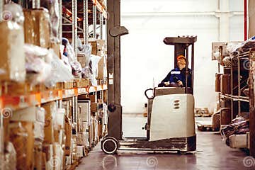 Man on Lift Operator in Uniform at Warehouse Stock Image - Image of ...