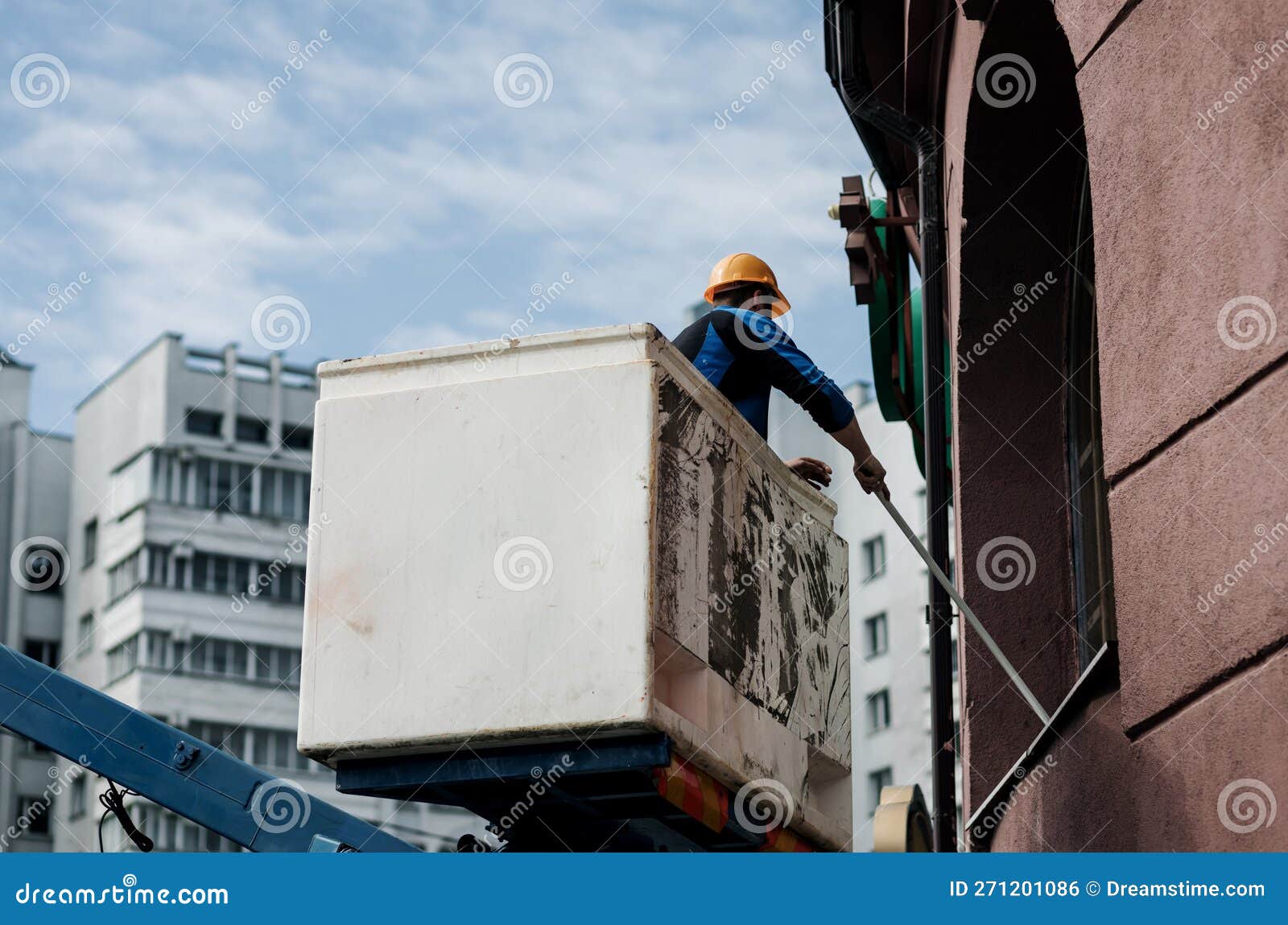 Man in lifting bucket stock photo. Image of exterior - 271201086