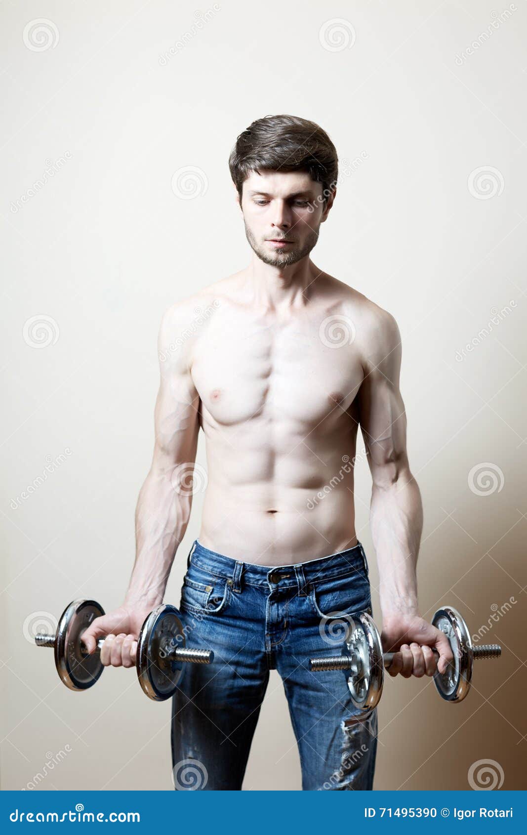 Man lifting dumbbell stock photo. Image of abdomen, bodybuilder - 71495390