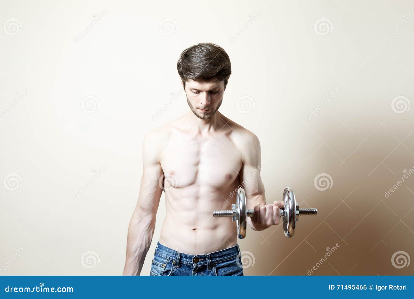 Man lifting dumbbell stock photo. Image of isolated, masculine - 71495466