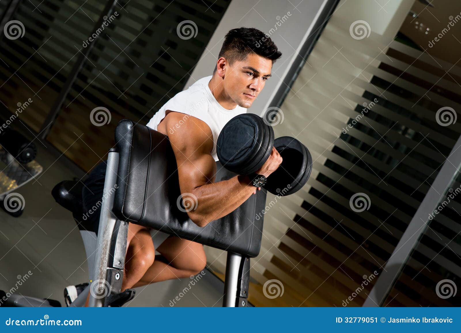 Man lifting dumbell in gym stock image. Image of dumbbell - 32779051