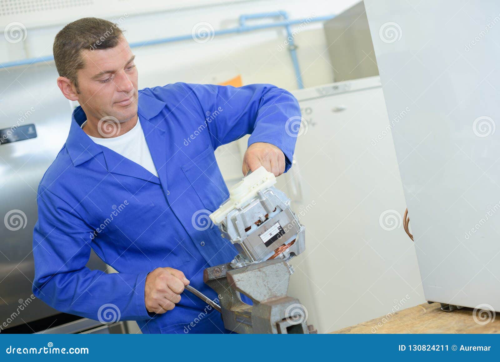 Man Lifting Heavy Object on To Vice Stock Image - Image of industrial ...