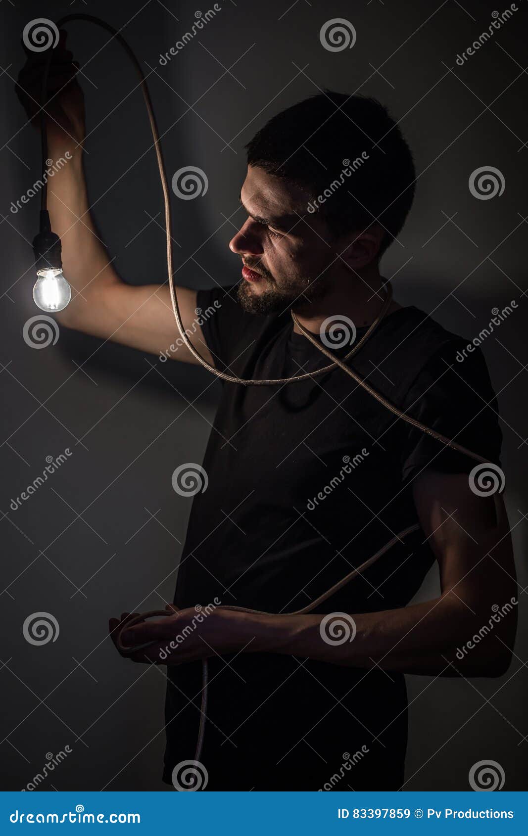 The Man with the Light Bulb on Black Background Stock Image - Image of ...
