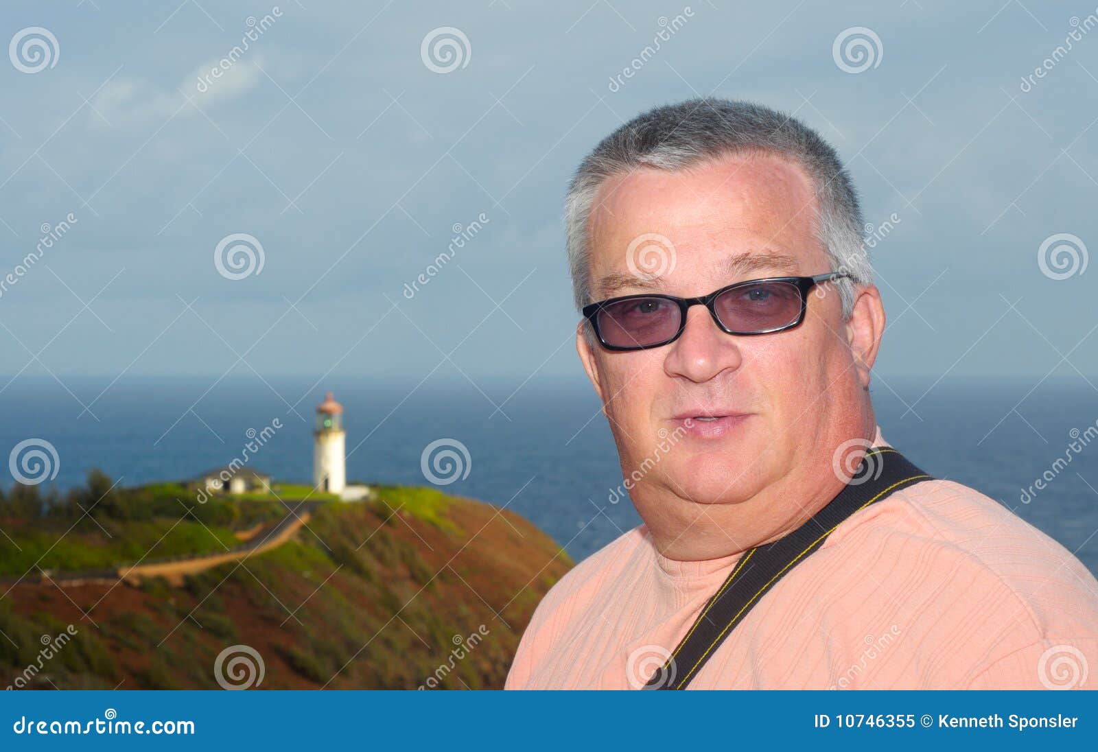 A man and a lighthouse stock image. Image of strap, caucasian - 10746355