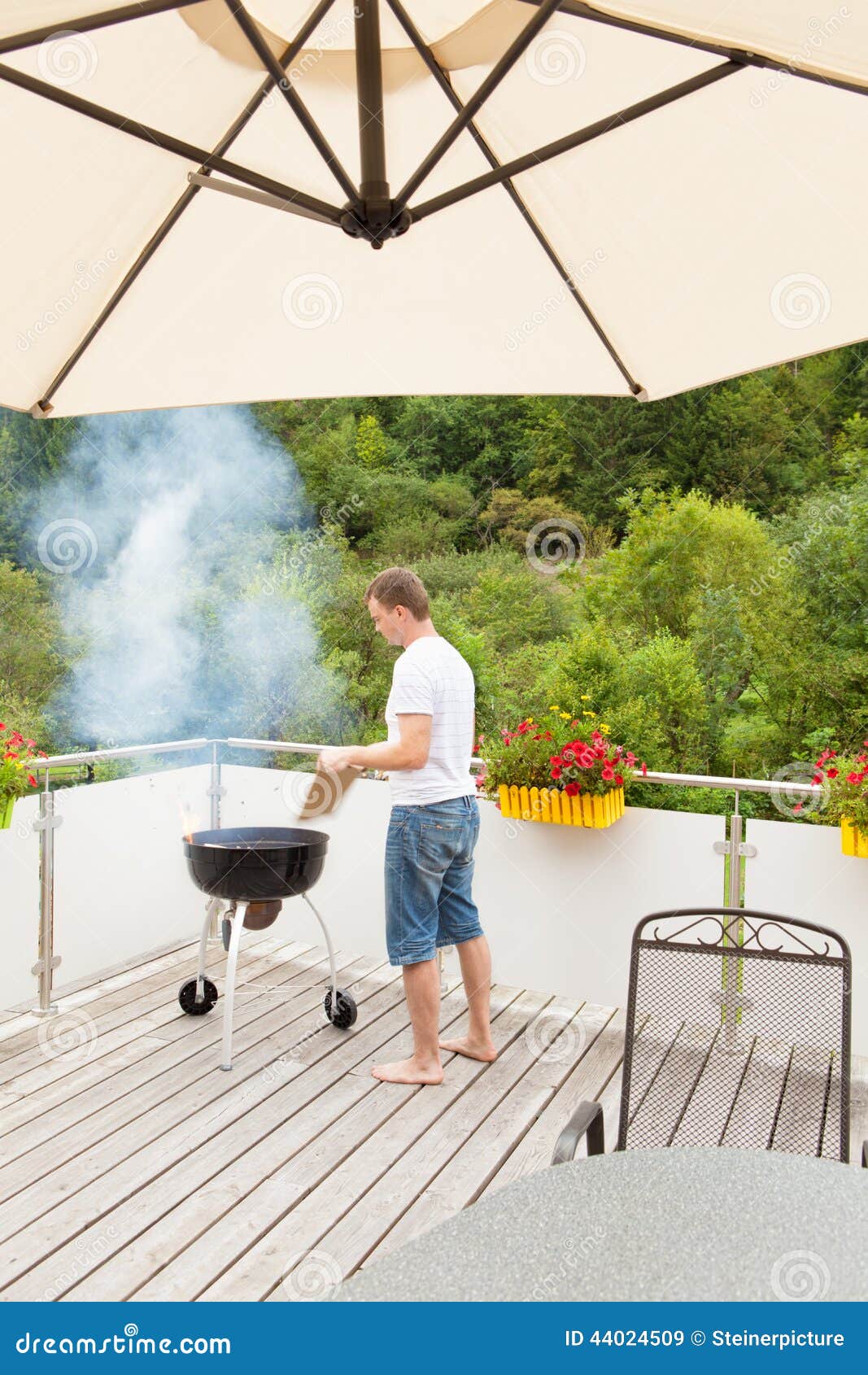 Man is Lighting the Fire for Bbq Stock Image - Image of roof, nature ...