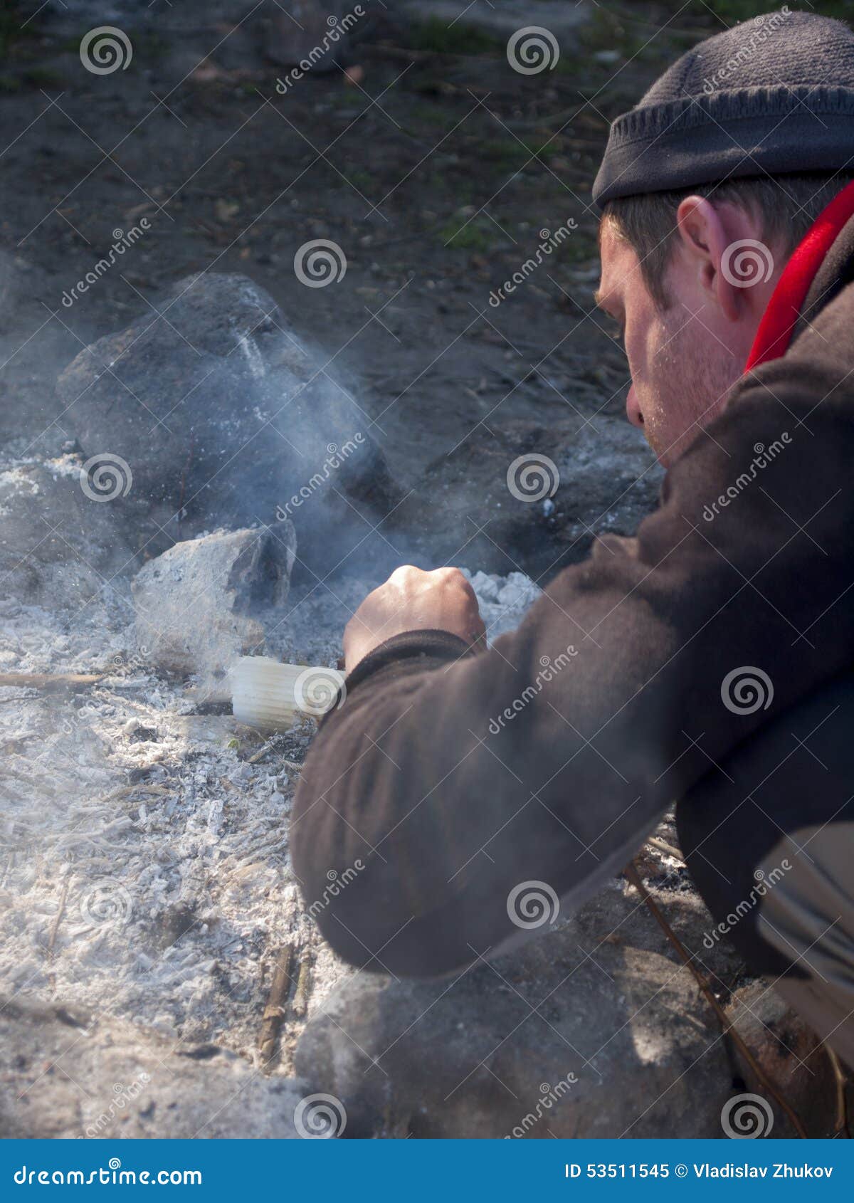 A man lighting a fire. stock image. Image of climbing - 53511545