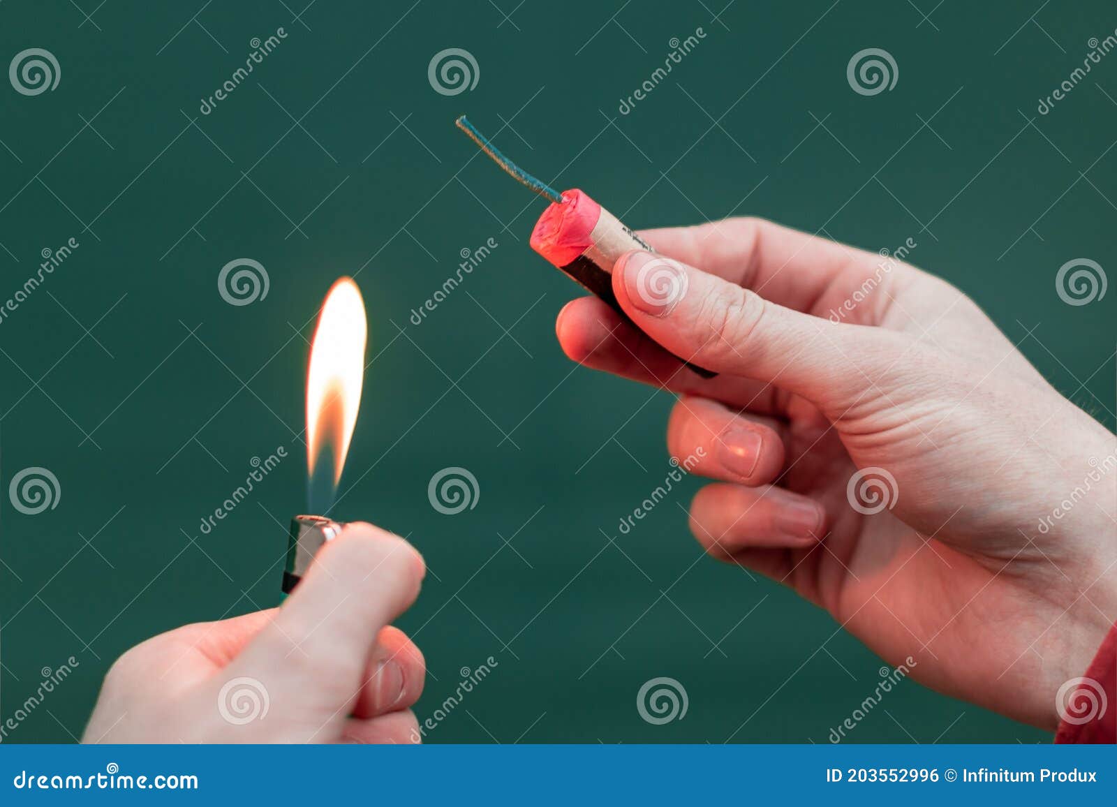 Man Lighting Up Firecracker in His Hand Stock Photo - Image of ...