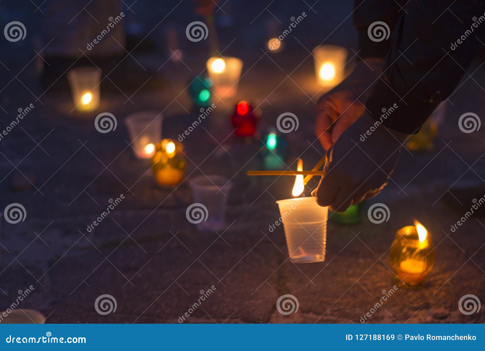 A Man Lights a Candle. Day of Remembrance for the Bereaved Stock Image ...