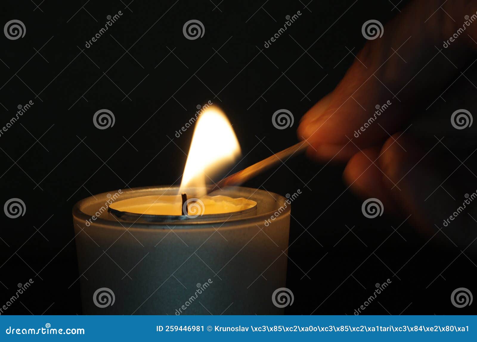 A Man Lights a Candle with a Match Stock Image - Image of night ...