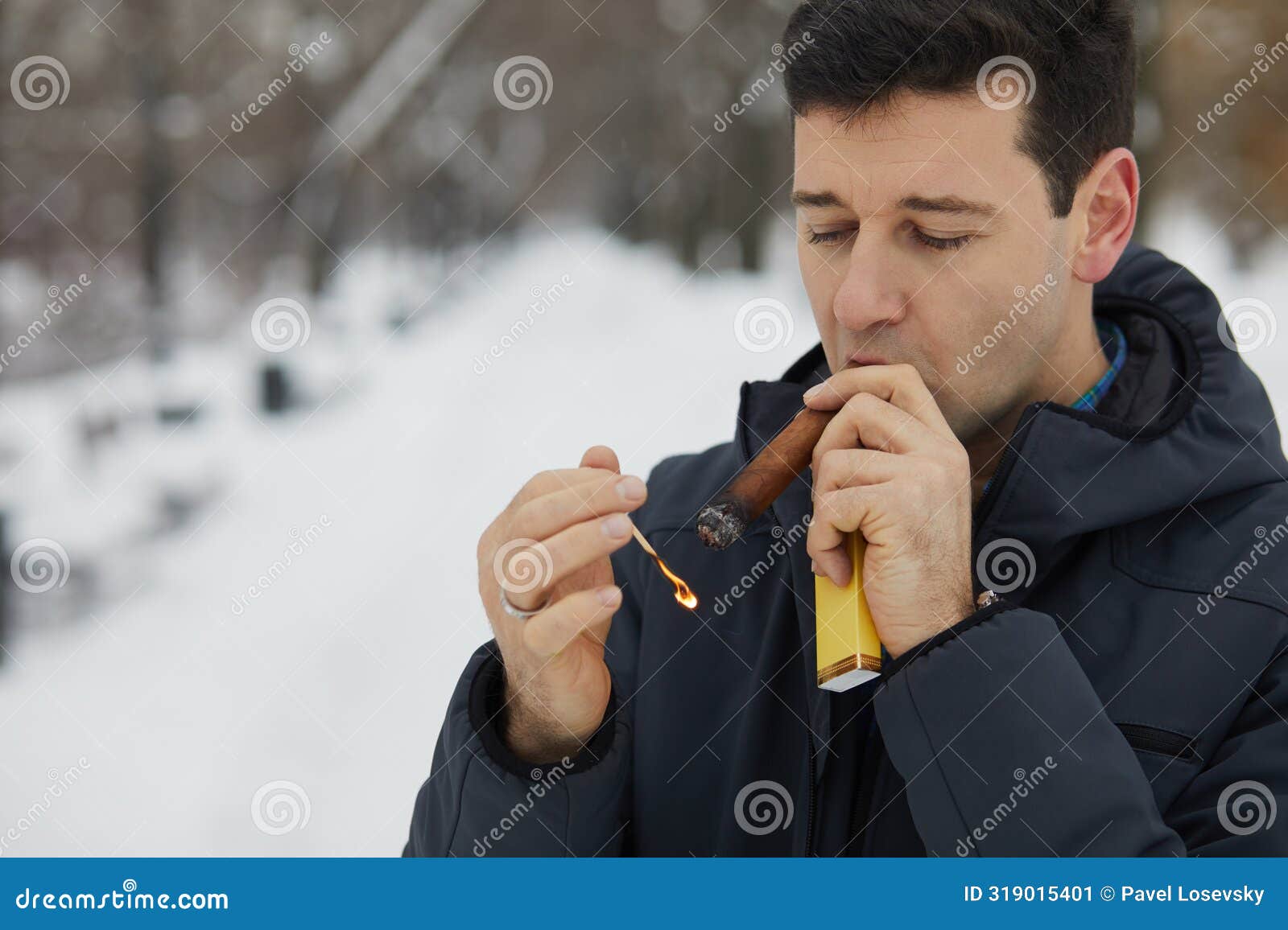 Man Lights and Puffs at Cigar in Winter Snowy Stock Image - Image of ...