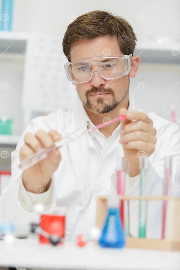Man with liquids in lab stock image. Image of glass - 268743299 Man with liquids in lab stock image. Image of glass - 268743299