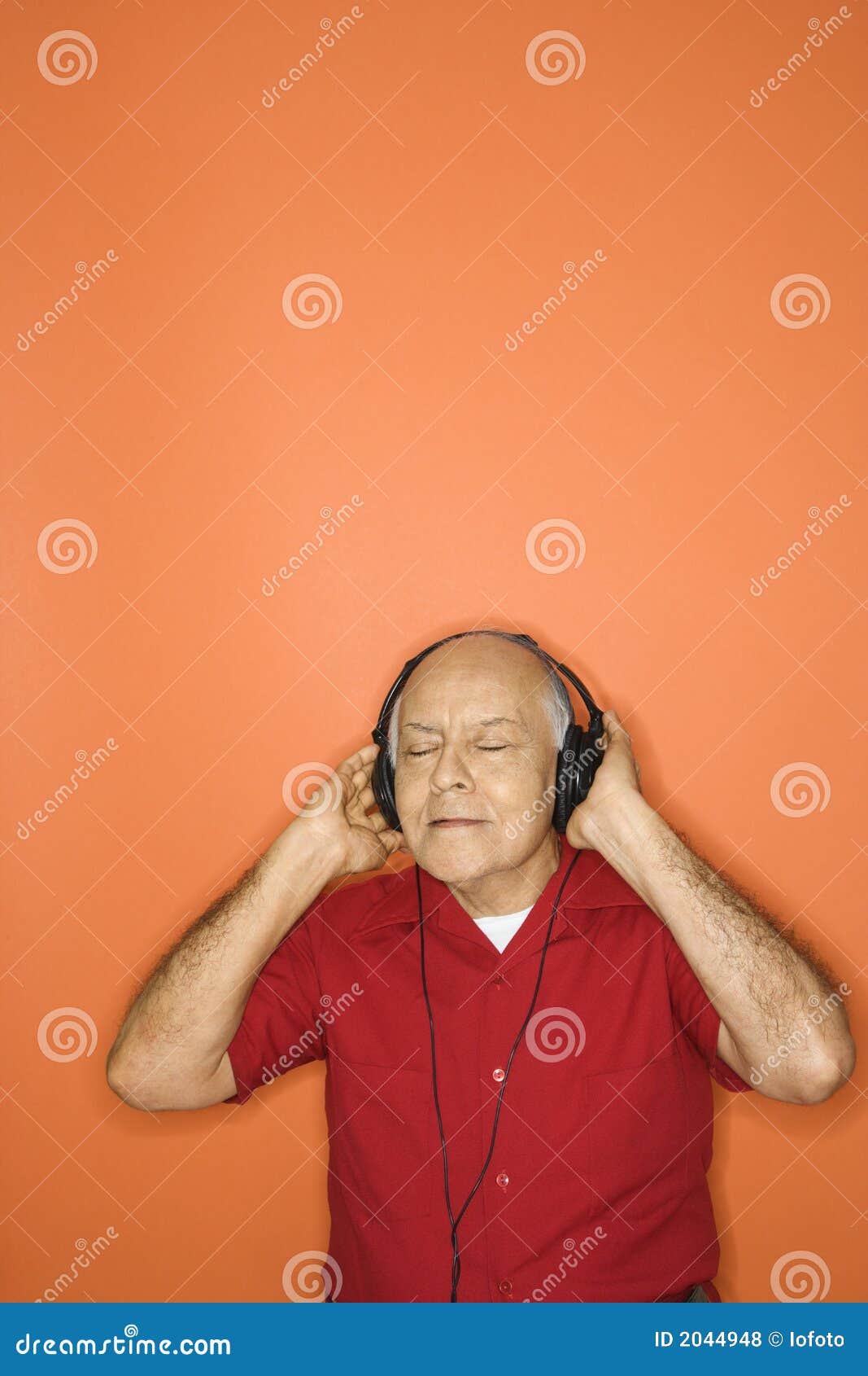 Man Listening To Headphones. Stock Photo - Image of colour, studio: 2044948