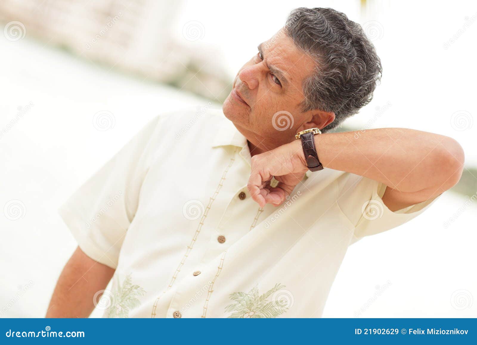 Man listening to his watch stock image. Image of adult - 21902629