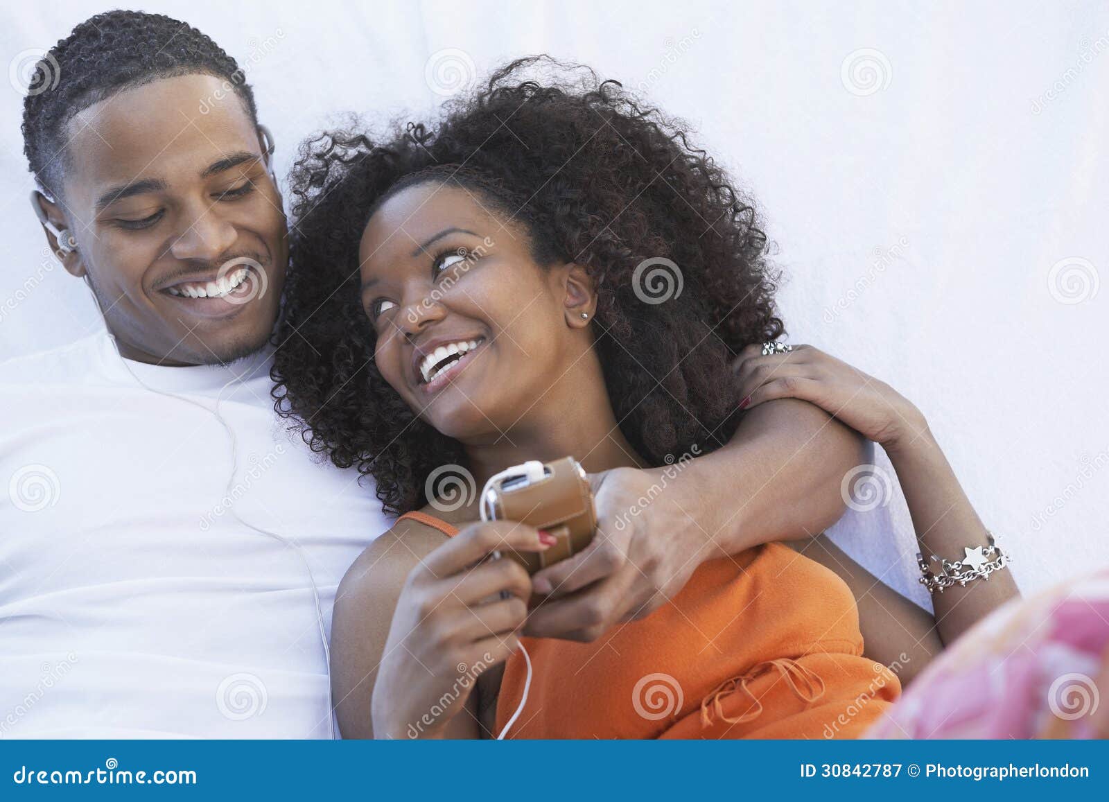 Guy Hugging Girlfriend On Date, Showing Something In Air, Young Couple ...