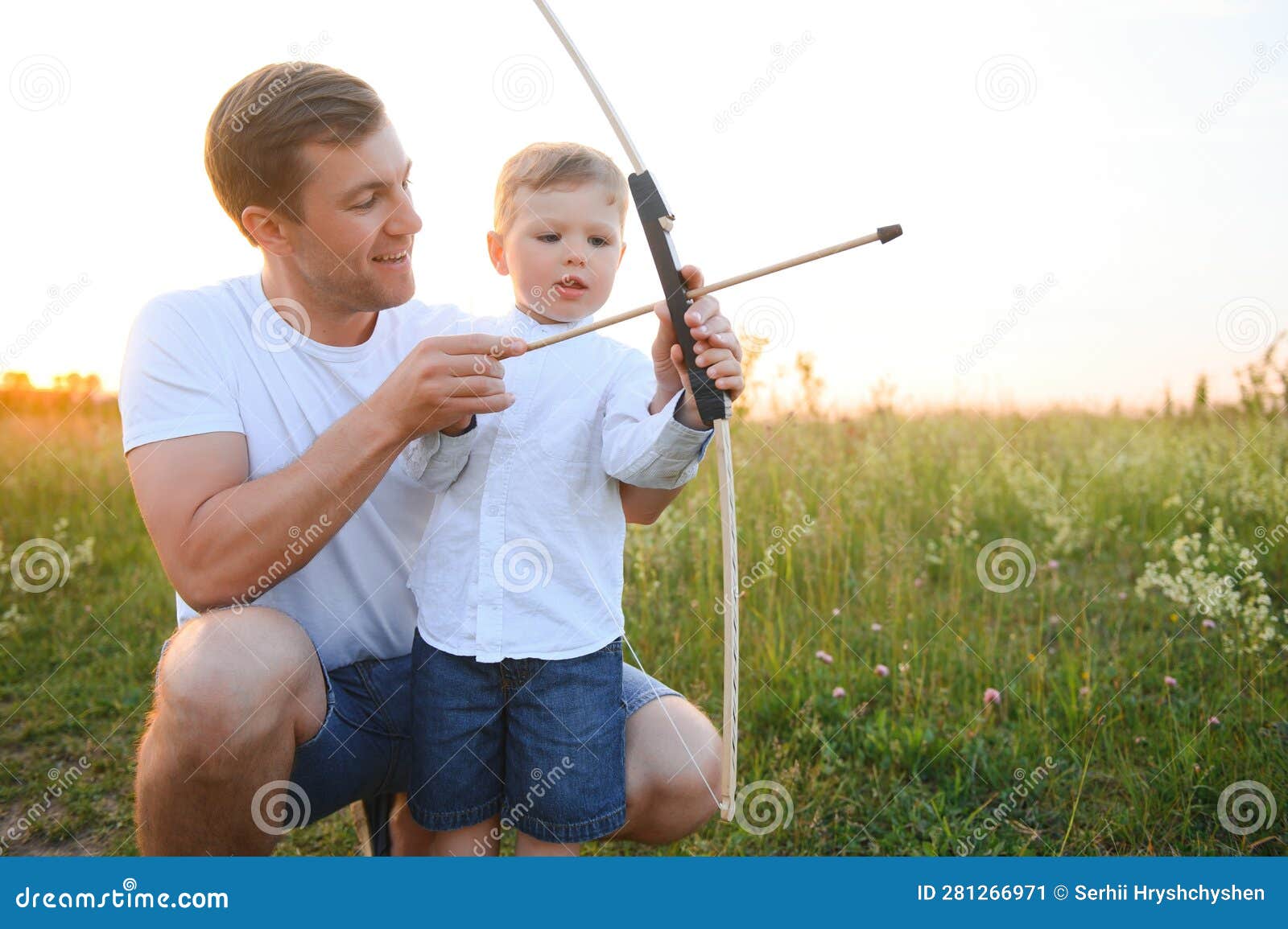 A Man and a Little Boy Doing Archery Stock Image - Image of archer ...
