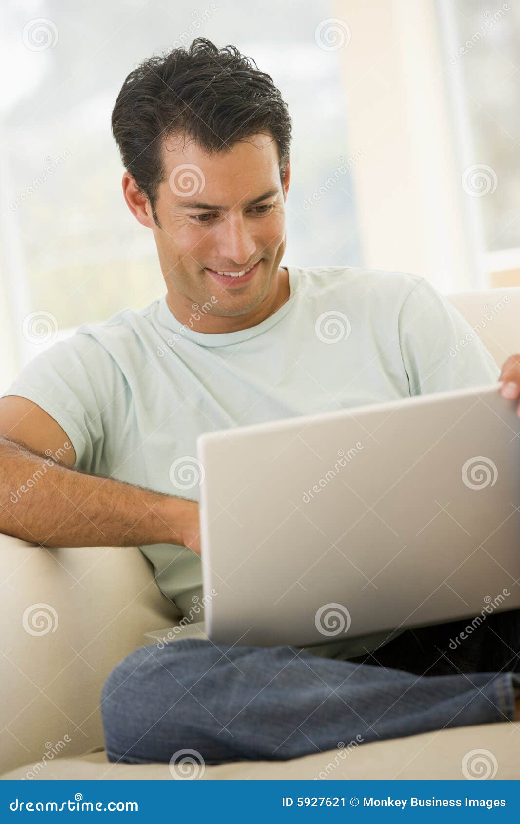 Man in Living Room Using Laptop Smiling Stock Image - Image of family ...