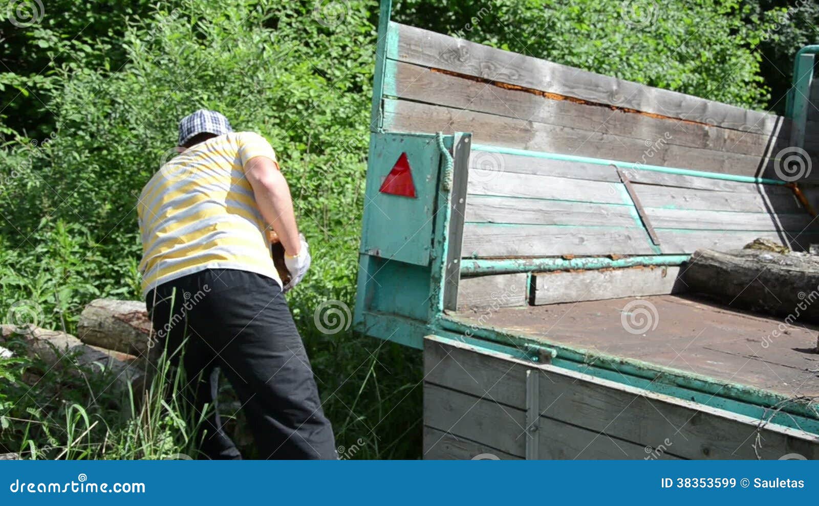 Man load log wood trailer stock footage. Video of outdoor - 38353599