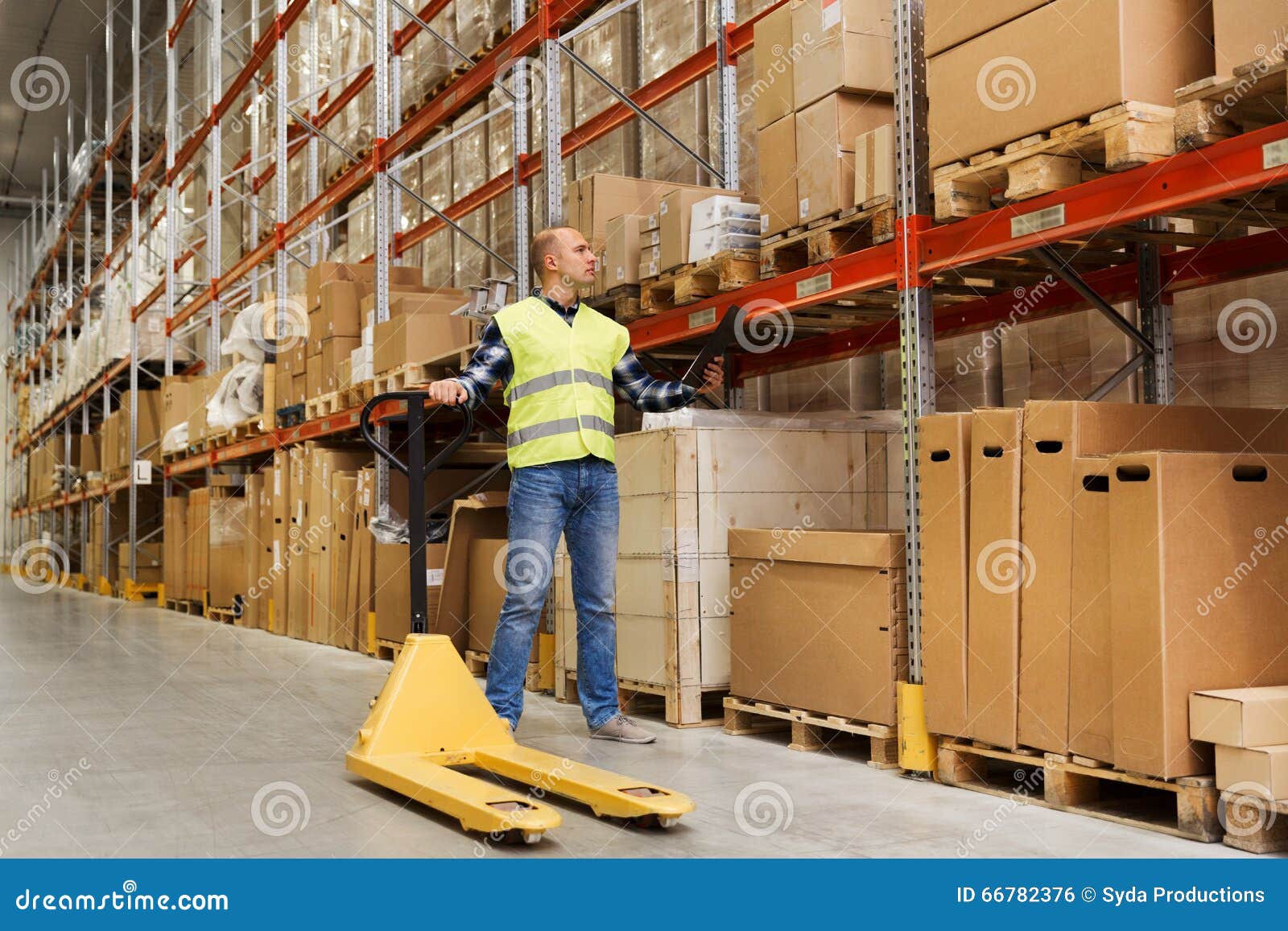 Man with Loader and Clipboard at Warehouse Stock Photo - Image of ...