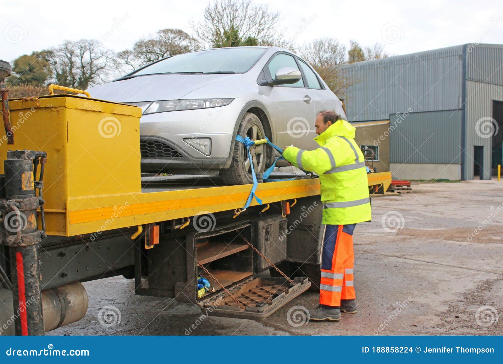 Man Loading Car on a Recovery Truck Stock Photo - Image of loading ...