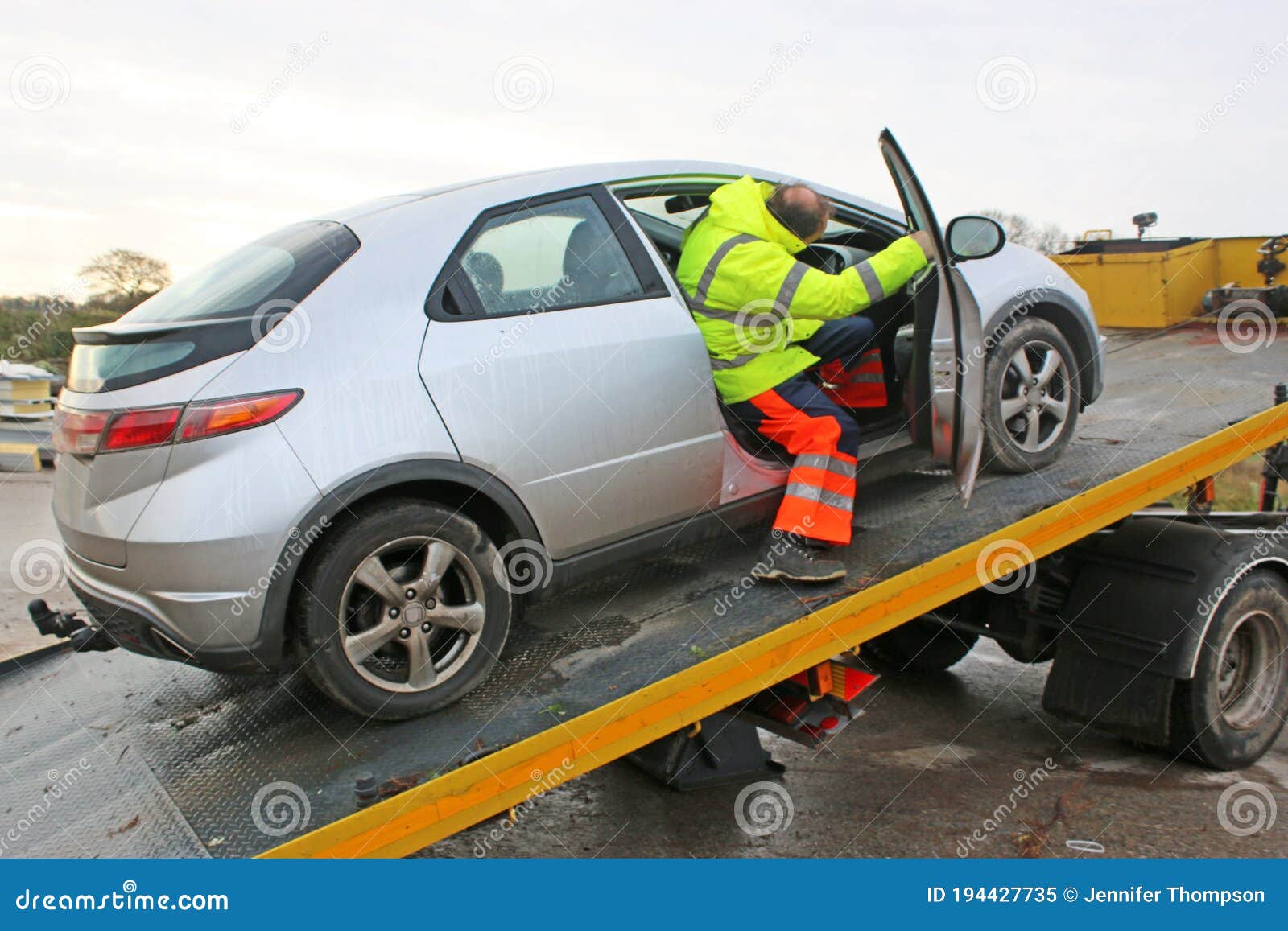 Man Loading Car on a Recovery Truck Stock Image - Image of rescue, work ...