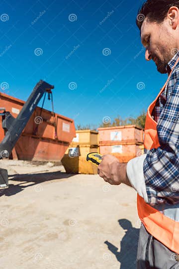 Man Loading of Construction Debris Container on Truck Stock Image ...
