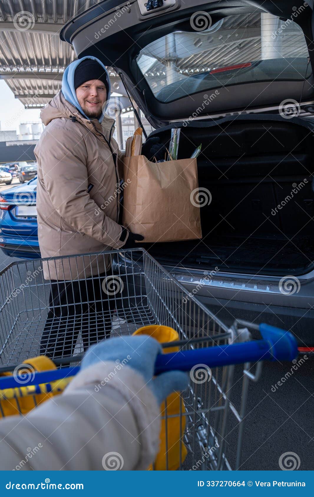 Man Loading Groceries into Car Trunk Stock Photo - Image of shelf ...