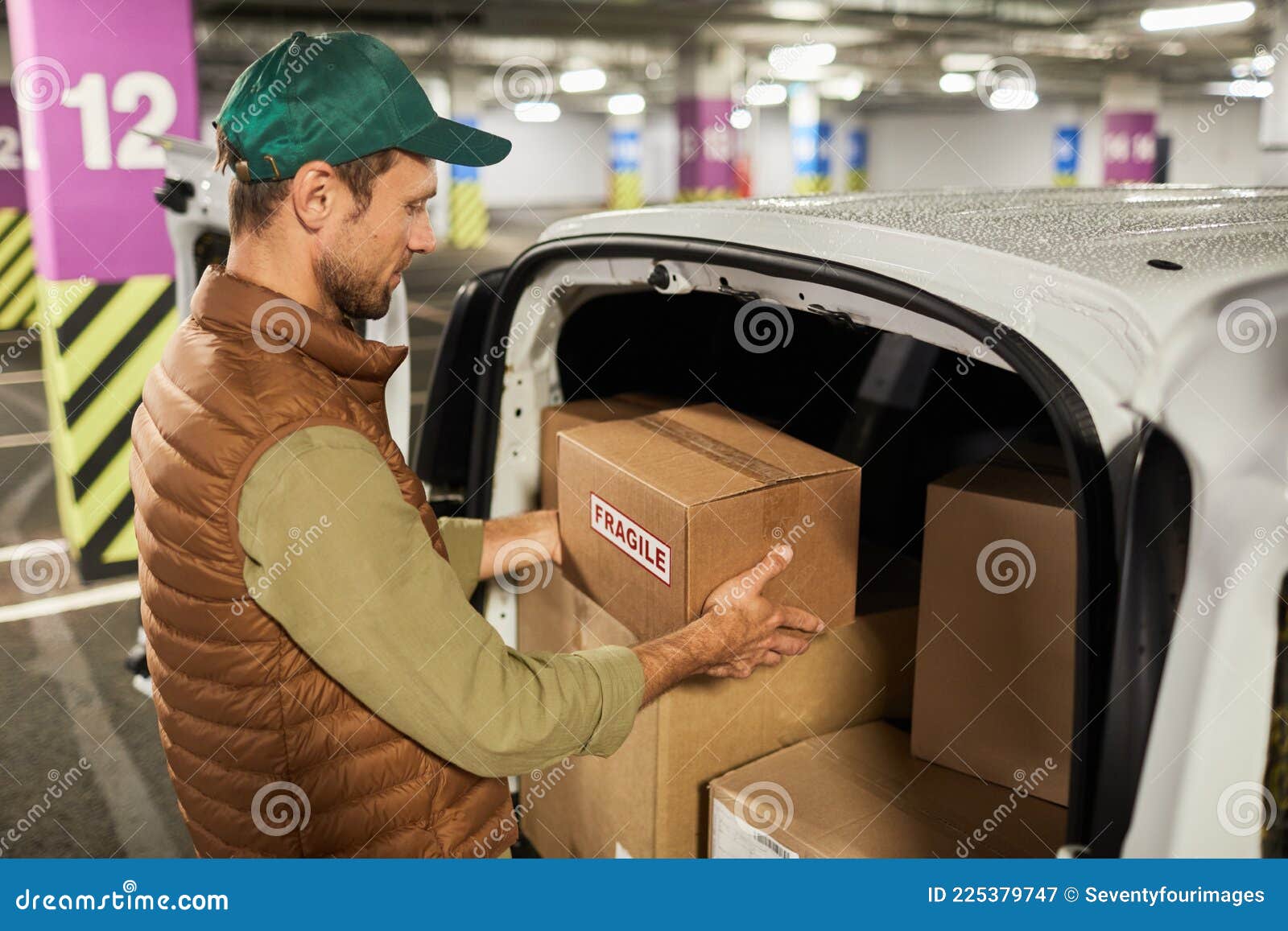 Man Loading Van Side View stock image. Image of industry - 225379747