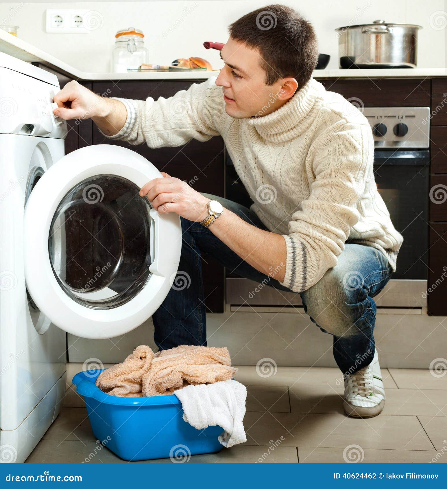 Man Loading the Washing Machine Stock Photo - Image of machine, laundry ...