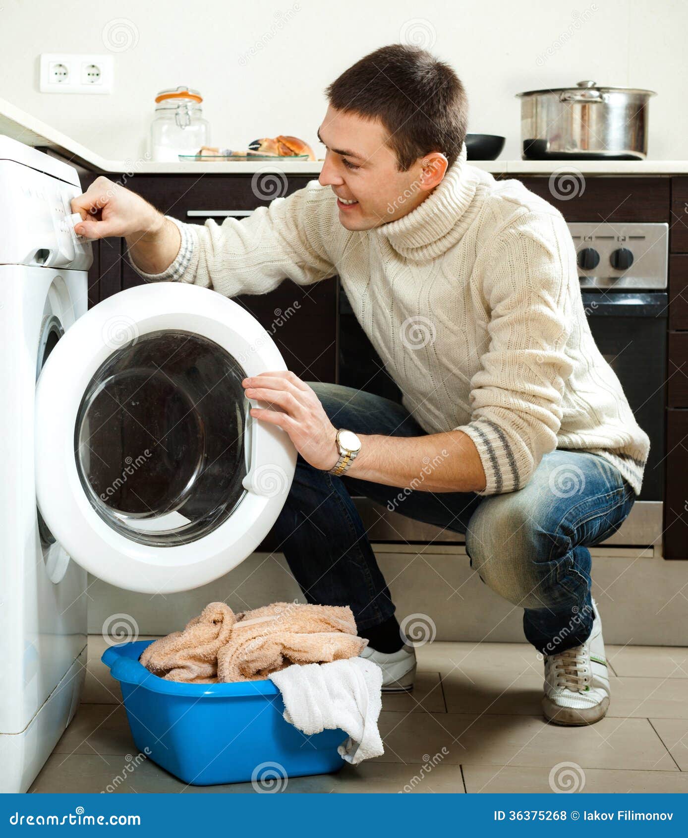Man Loading the Washing Machine Stock Photo - Image of machine, adult ...