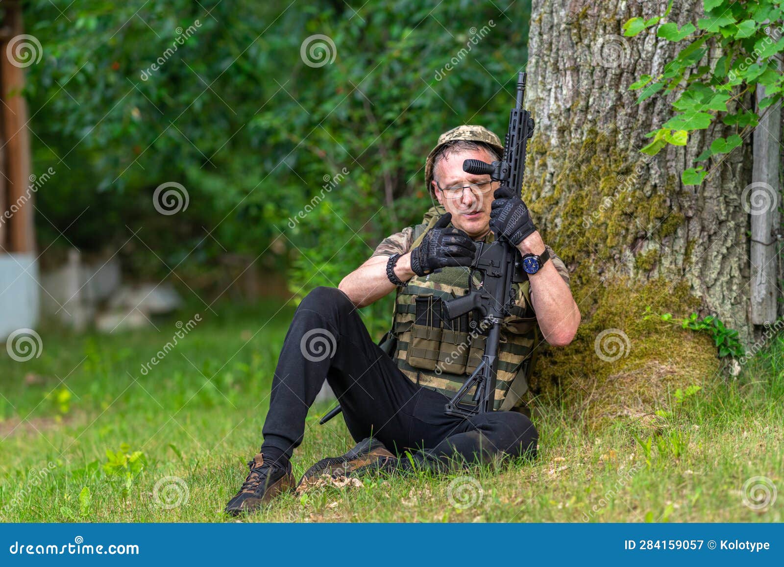 A Man Loading a Weapon on a Halt Stock Image - Image of mission ...