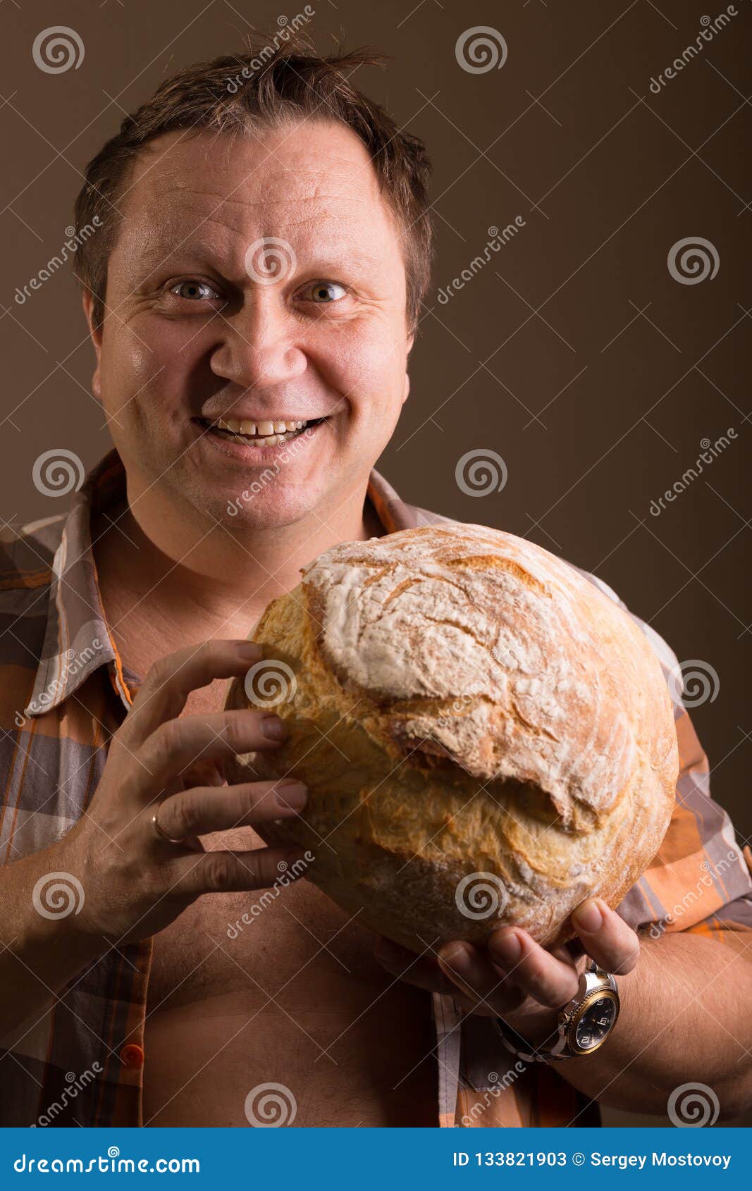 Man and loaf of bread 3 stock image. Image of pastry - 133821903