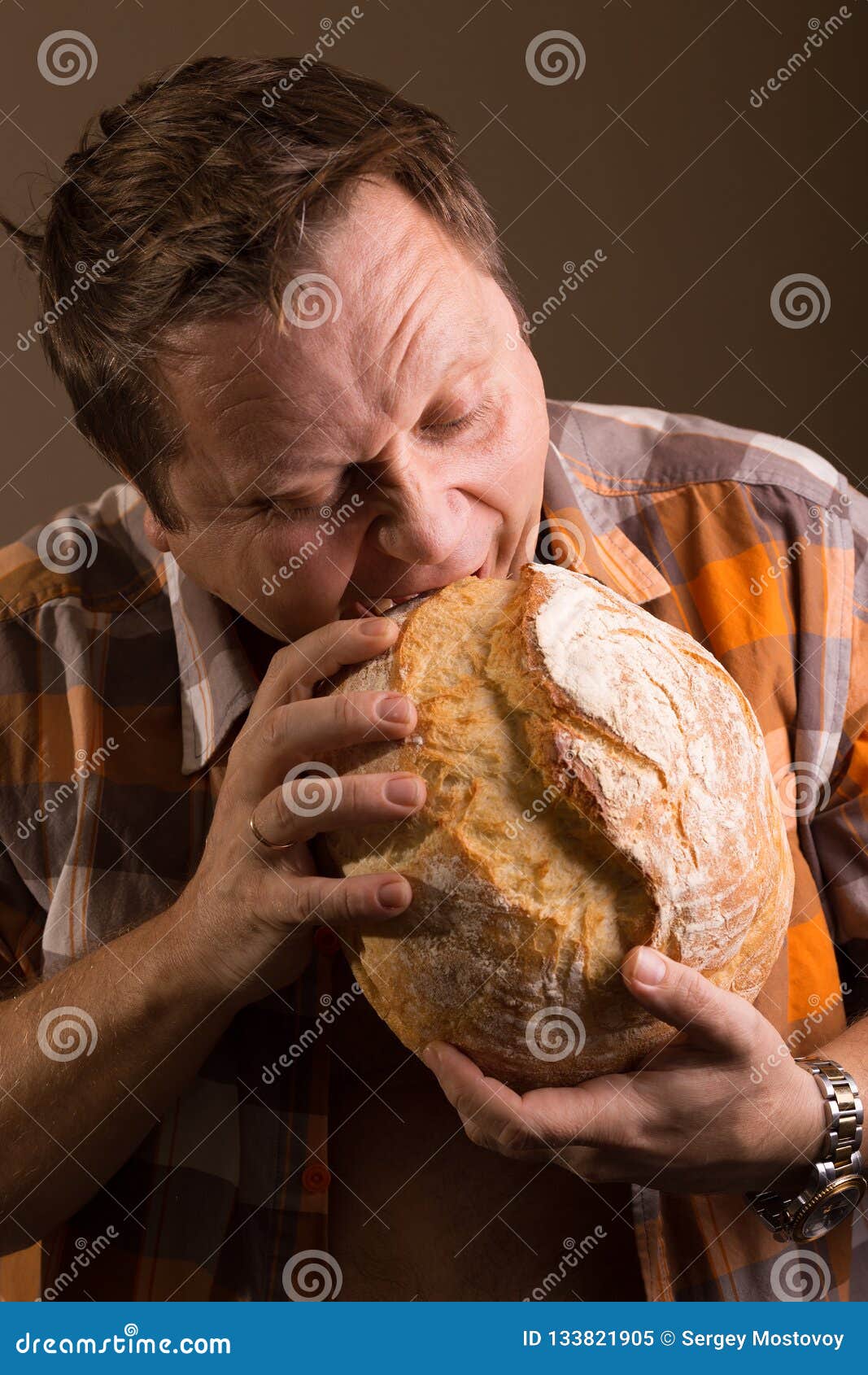 Man and loaf of bread stock image. Image of country - 133821905