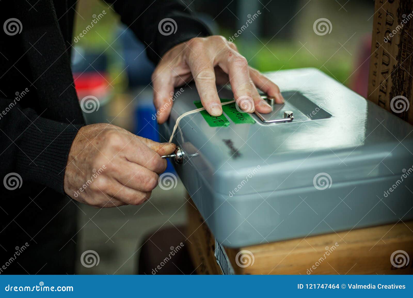 Man is Locking a Security Box at the Market Stock Photo - Image of ...