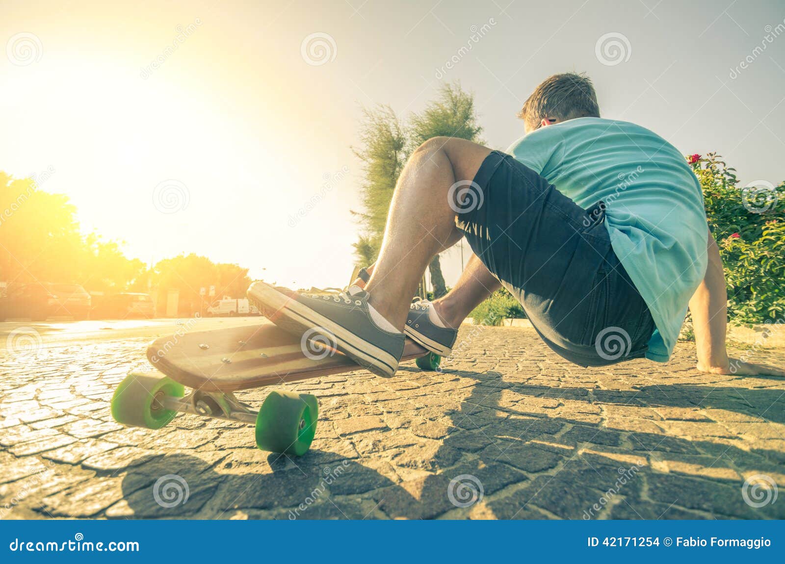Man on longboard at sunset stock photo. Image of longboard - 42171254