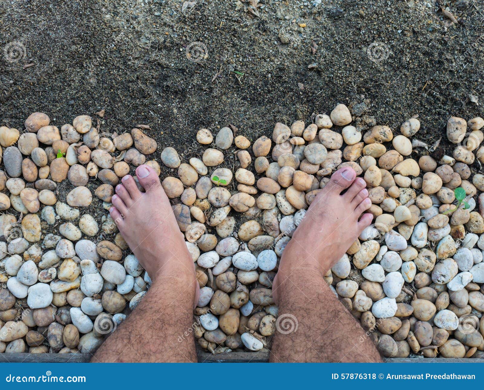 A Man Look Down To His Feet, Stand on the Rocks. Stock Photo - Image of ...
