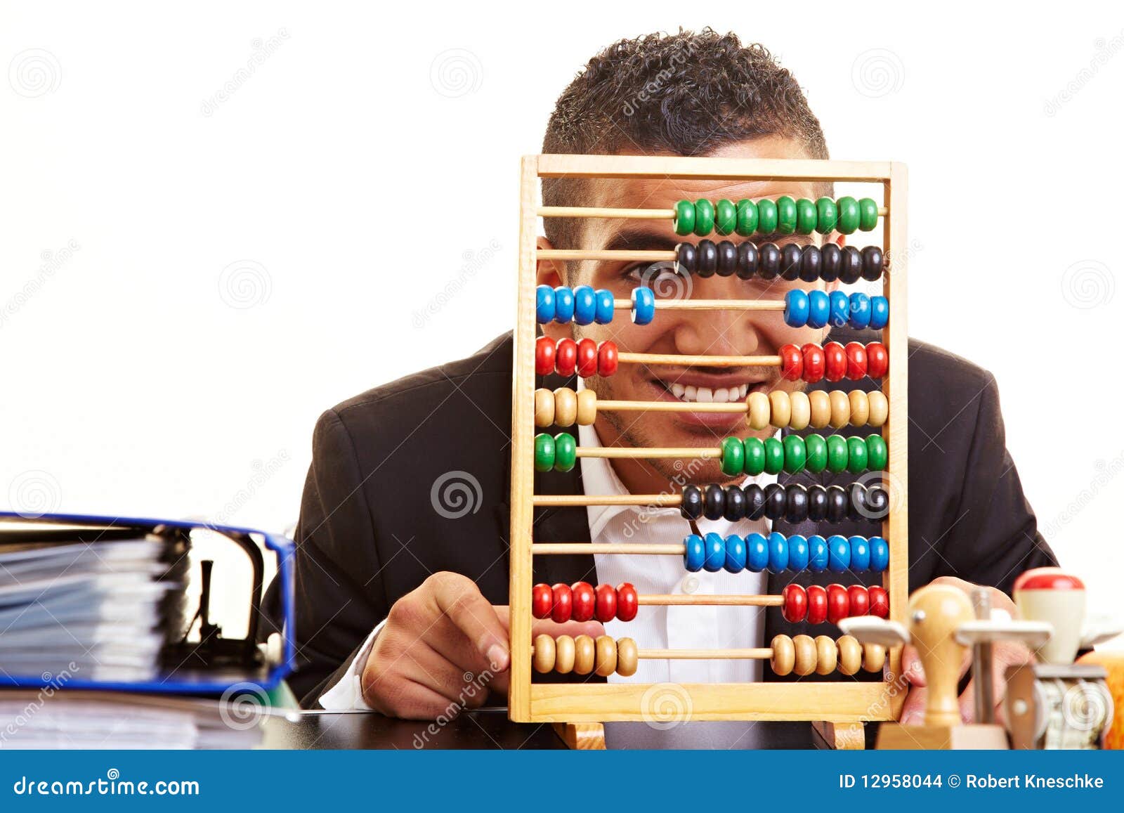 Man looking through abacus stock photo. Image of beard - 12958044