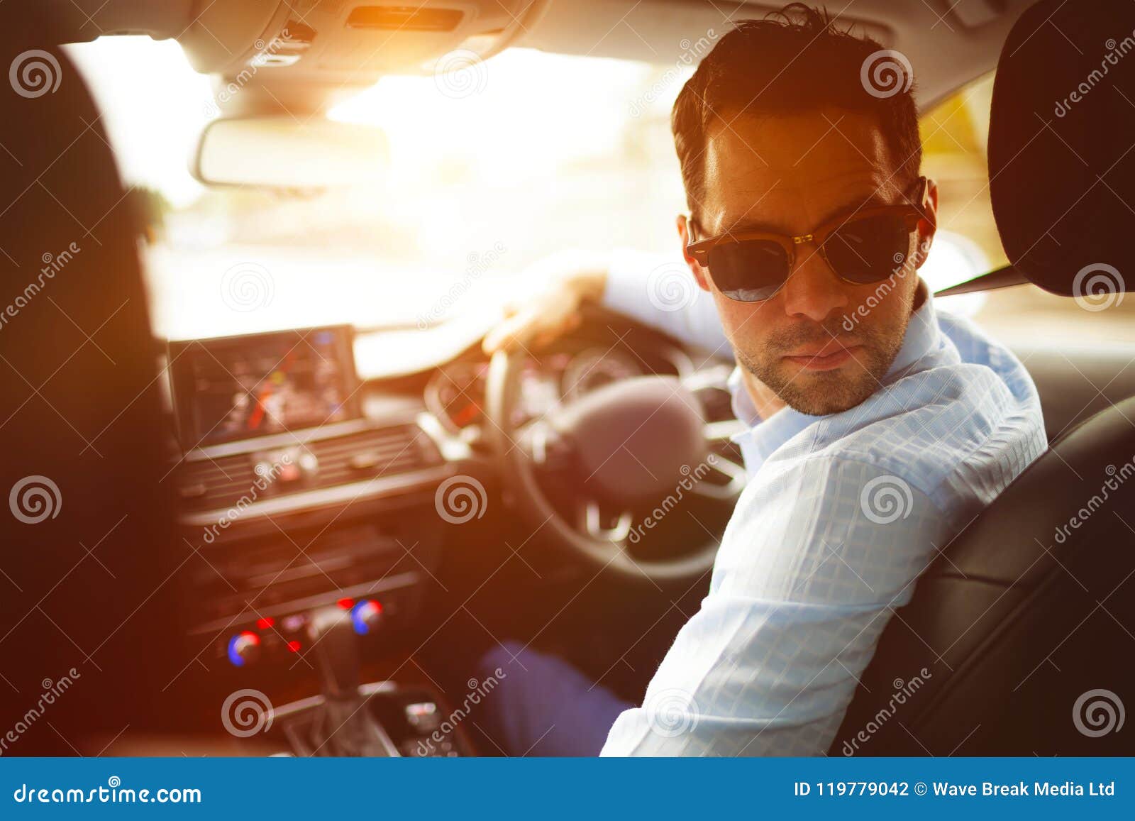 Man Looking Back while Driving Car Stock Photo - Image of busy, land ...