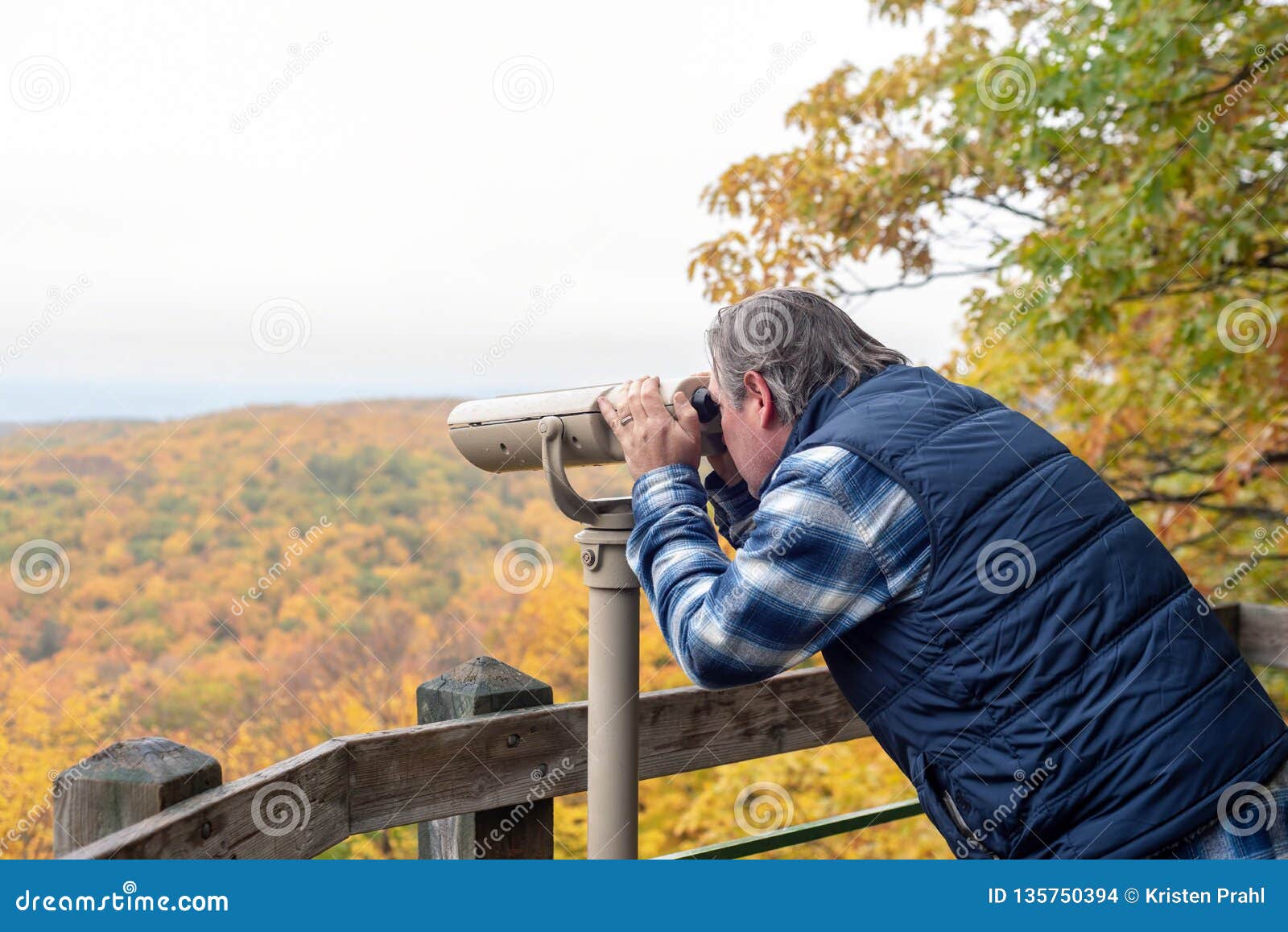 Man Looking through Binoculars at Scenic Overlook Stock Photo - Image ...