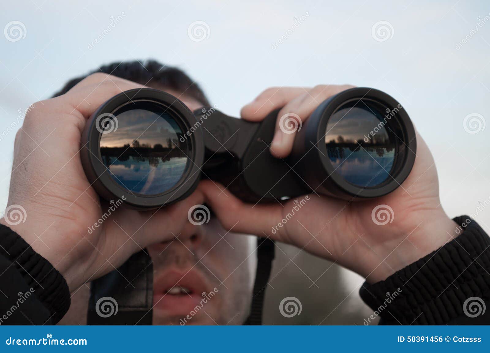 Man Looking through Binoculars at Sunset Stock Photo - Image of summer ...