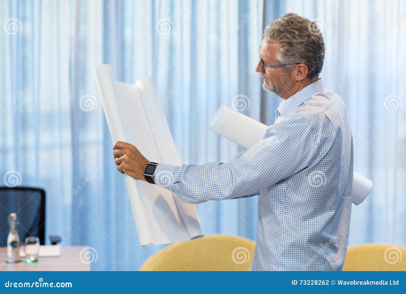 Man looking at blueprint stock photo. Image of blueprint - 73228262